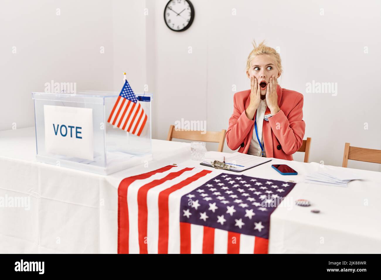Beautiful caucasian woman working at political campaign afraid and ...
