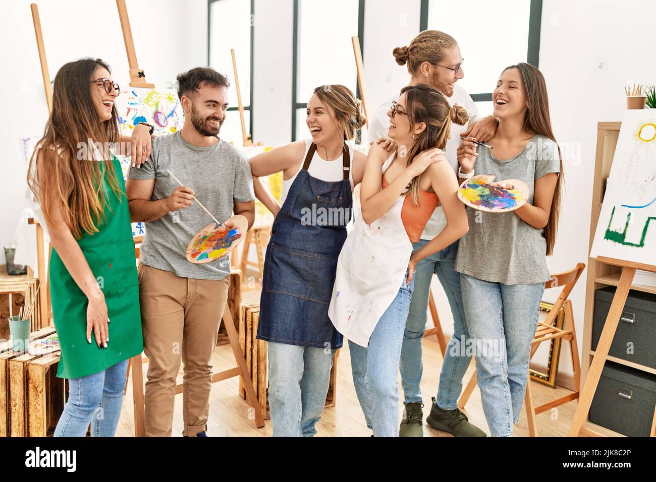 Group of young paint students smiling happy standing at art studio ...