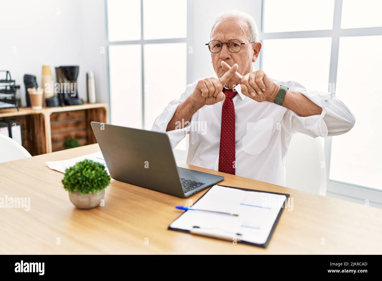 Senior man working at the office using computer laptop rejection ...