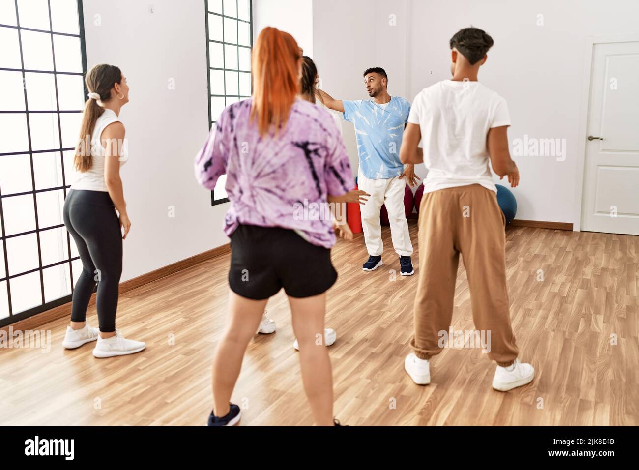 Group of young dancer smiling happy dancing choreography at dance ...