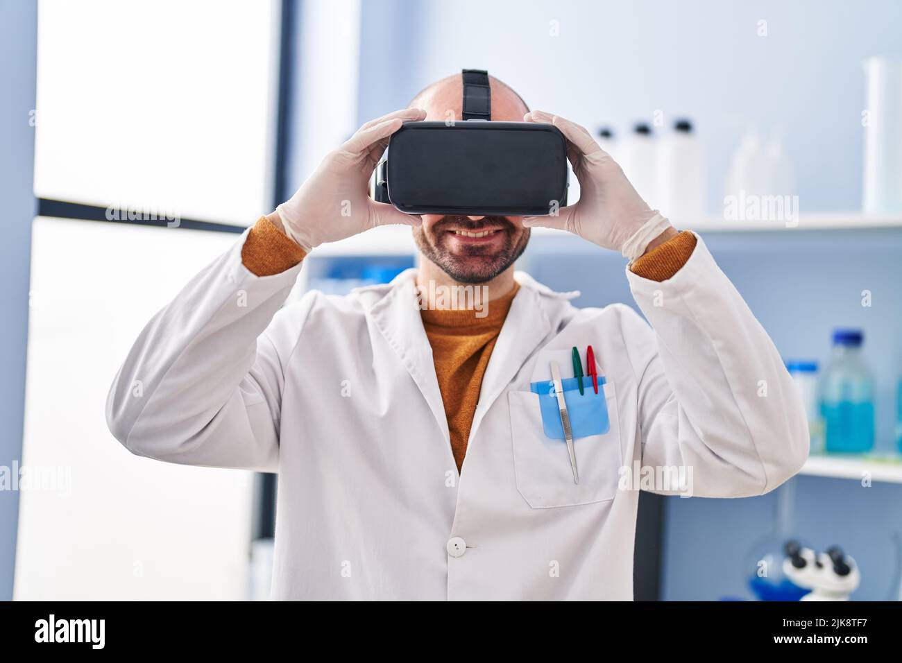 Young man scientist using virtual reality goggles at laboratory Stock ...