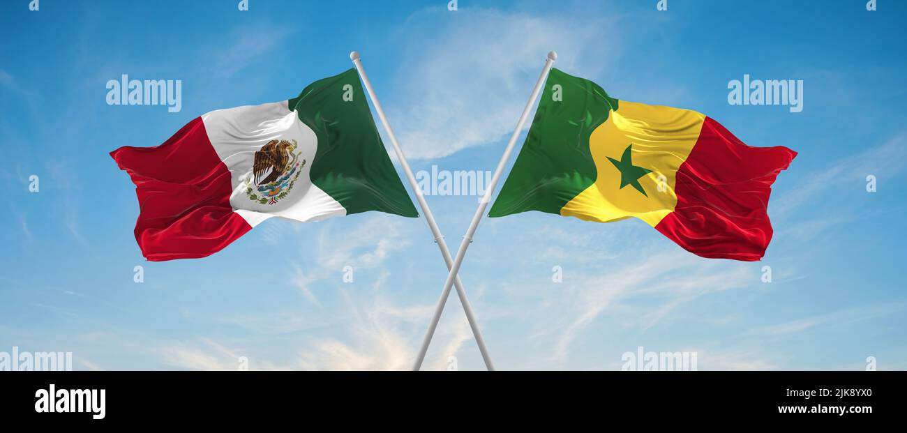 two crossed flags Senegal and mexico waving in wind at cloudy sky. Concept of relationship ...