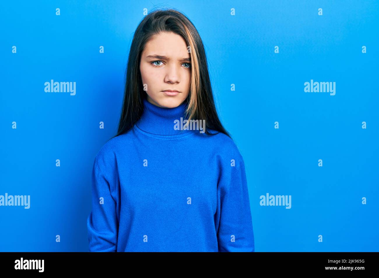 Young brunette girl wearing turtleneck sweater skeptic and nervous ...