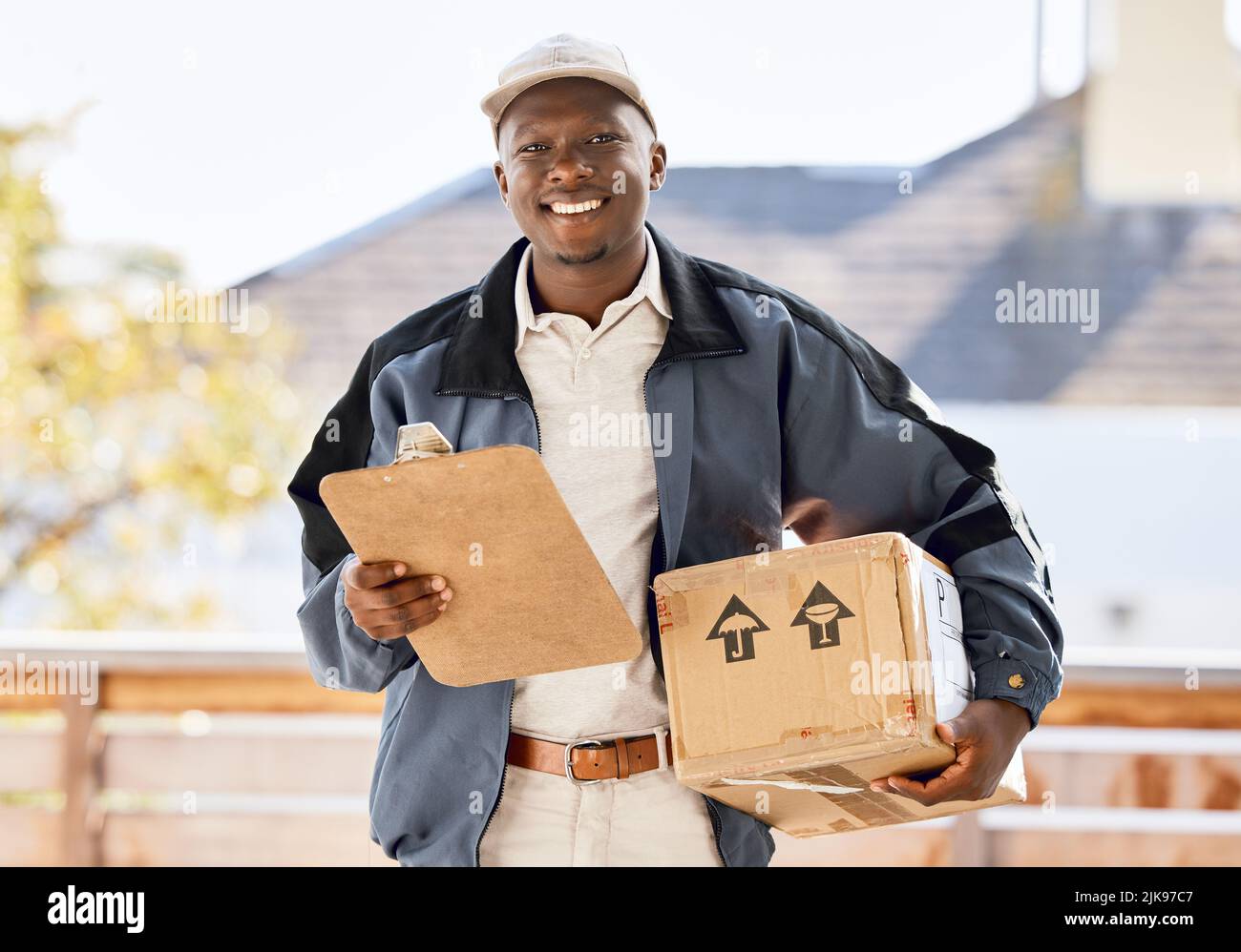 Delivery on time and service with a smile. young man delivering a ...
