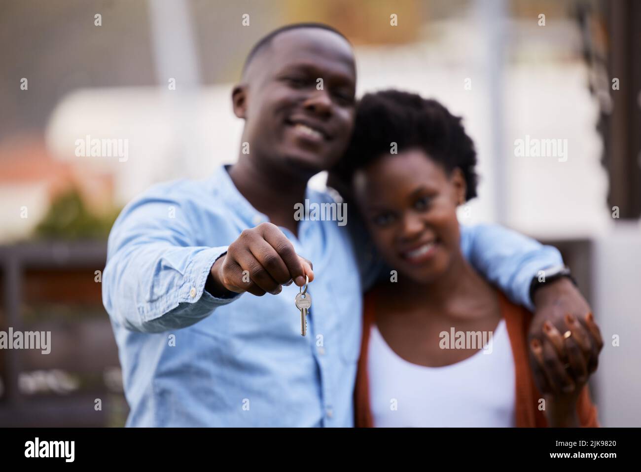 We said yes to the address. Portrait of a young couple holding the keys ...