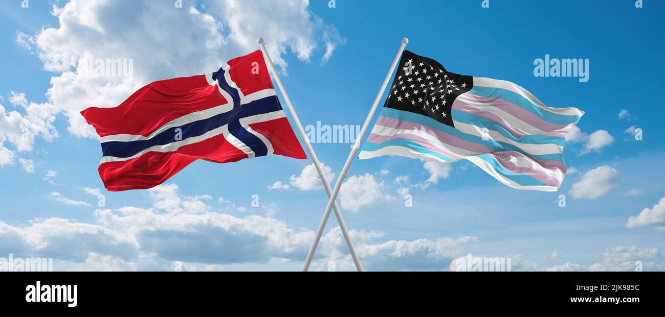 two crossed flags TransAmerica and Norway waving in wind at cloudy sky ...