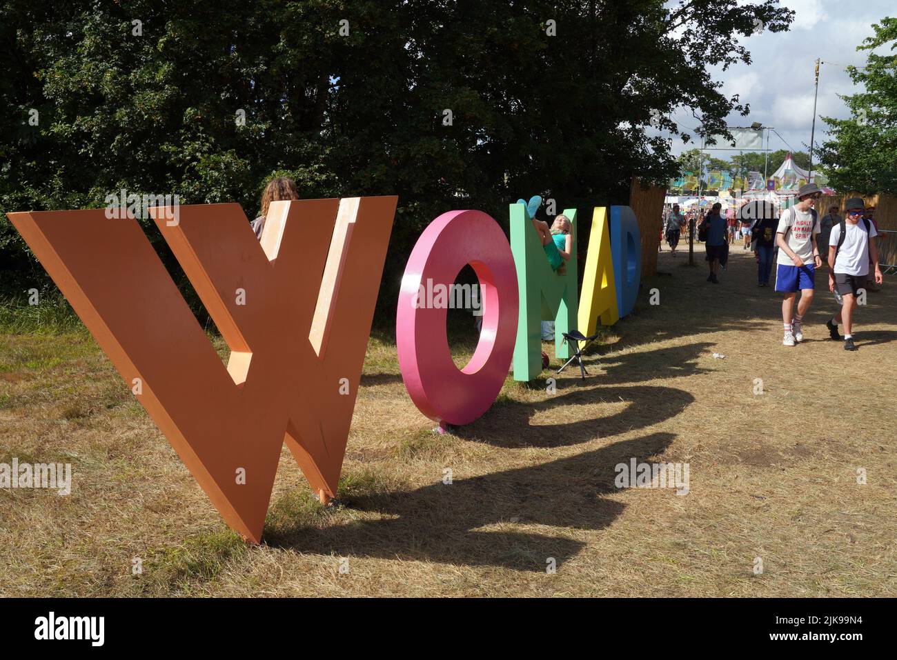 Charlton Park, Wiltshire, UK. 31st Aug, 2022. WOMAD sign with girl ...