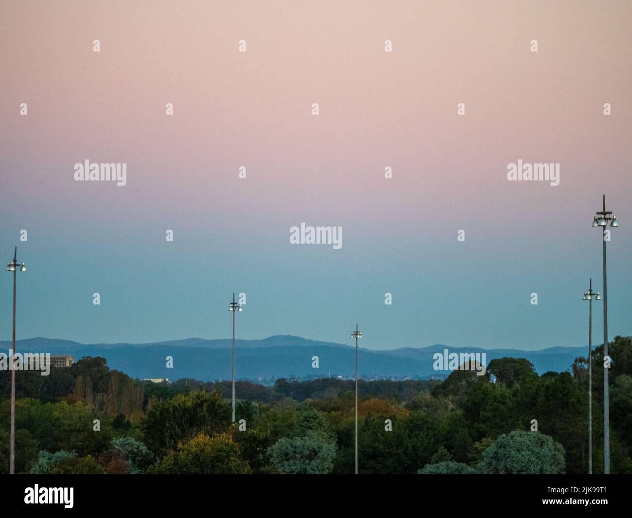 Canberra Skyline at dusk, serene pink and blue layered sky and ...