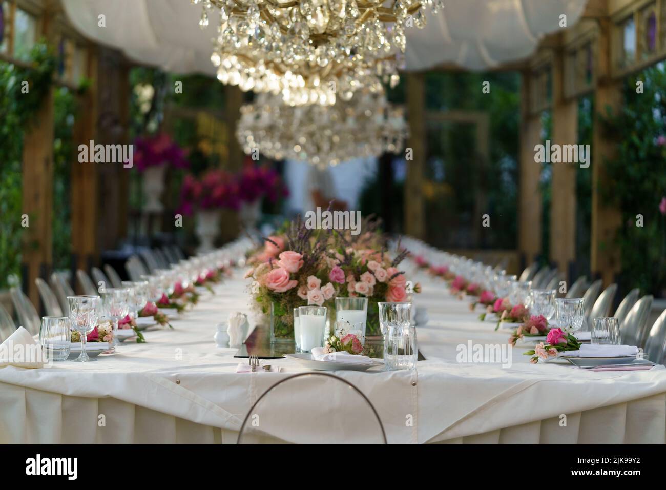 Event, holiday or wedding banquet table with flowers decoration ...
