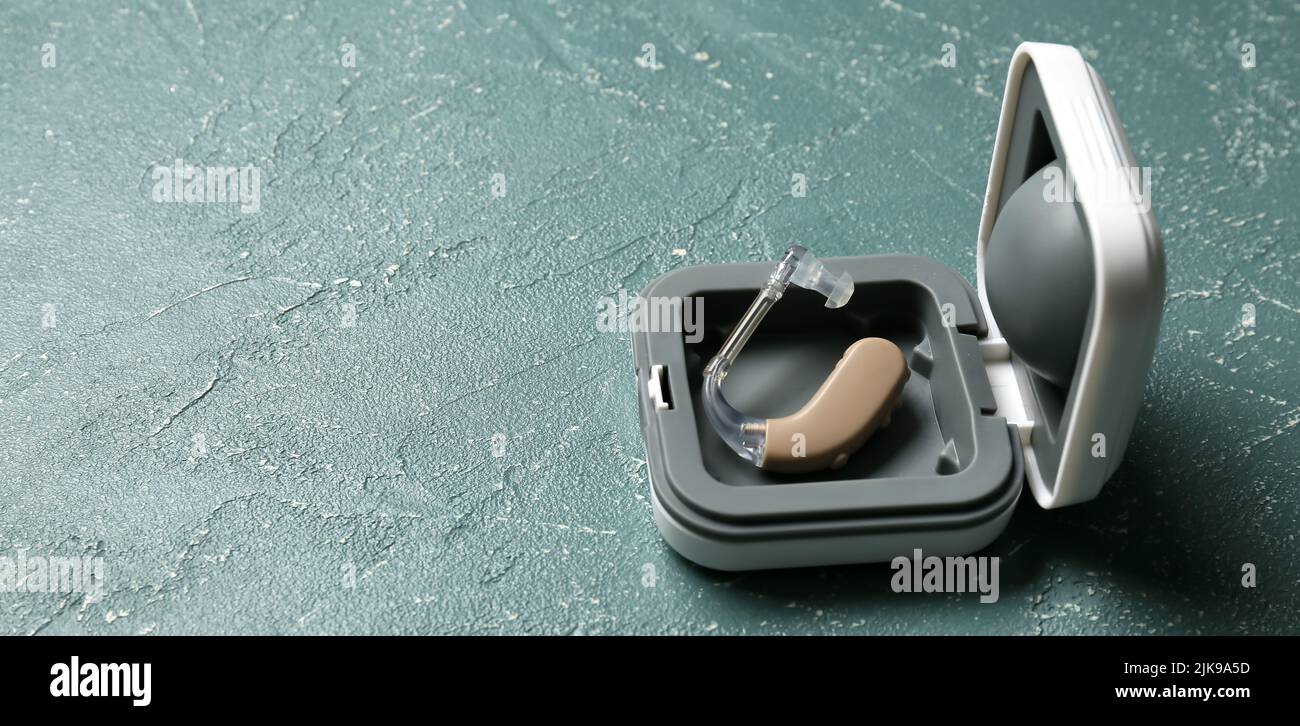 Box with hearing aid on grey background with space for text Stock Photo ...