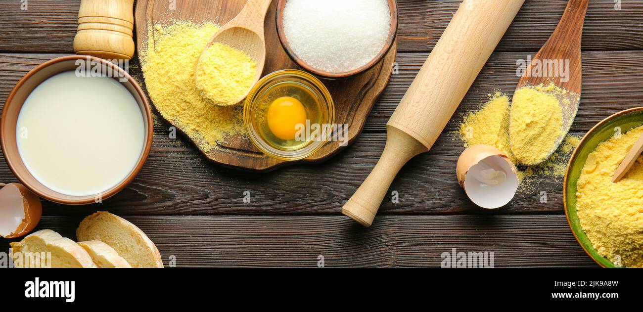 Corn flour with fresh products and kitchen utensils on wooden ...