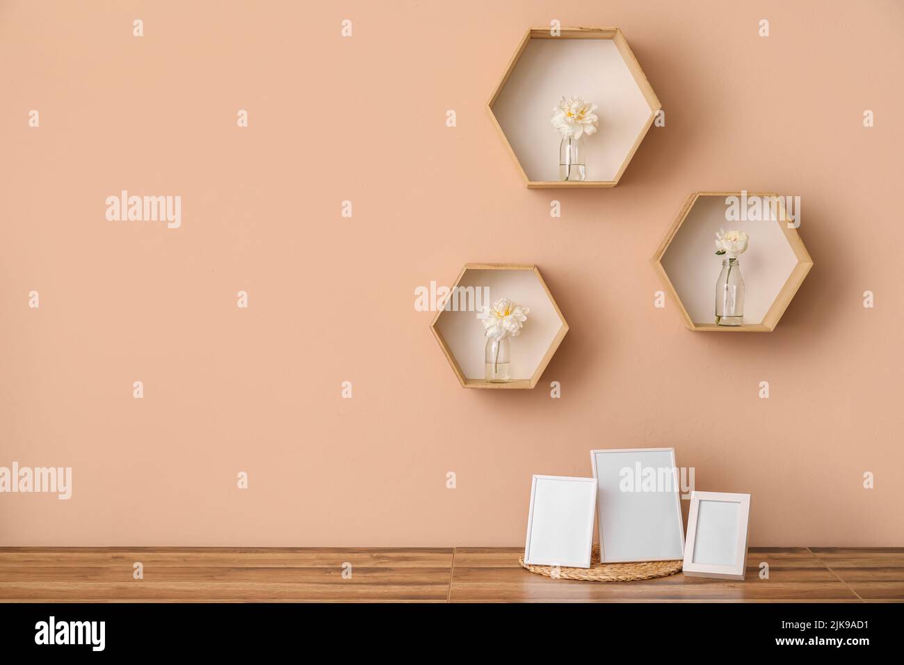 Blank photo frames on kitchen counter and shelves with beautiful peony ...