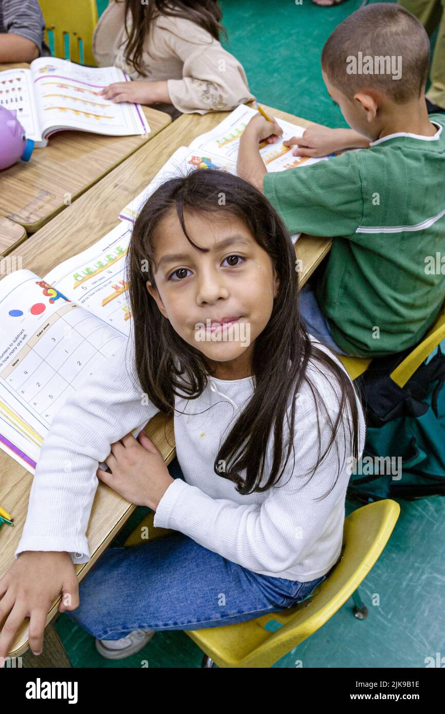 Hispanic girl girls classroom desk desks hi-res stock photography and ...