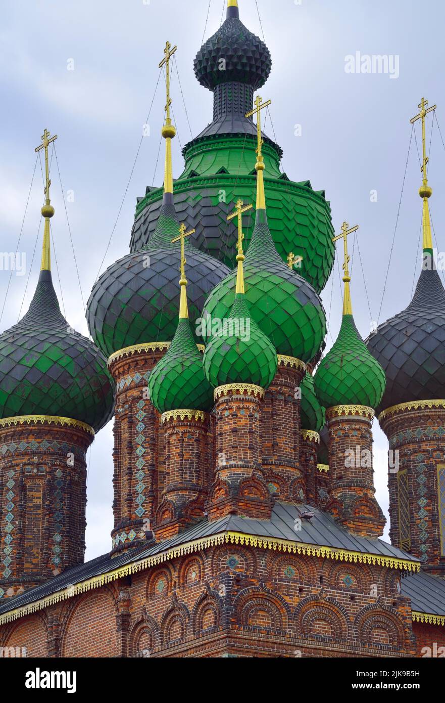 The Church of John the Baptist. Domes of a brick church with colored ...