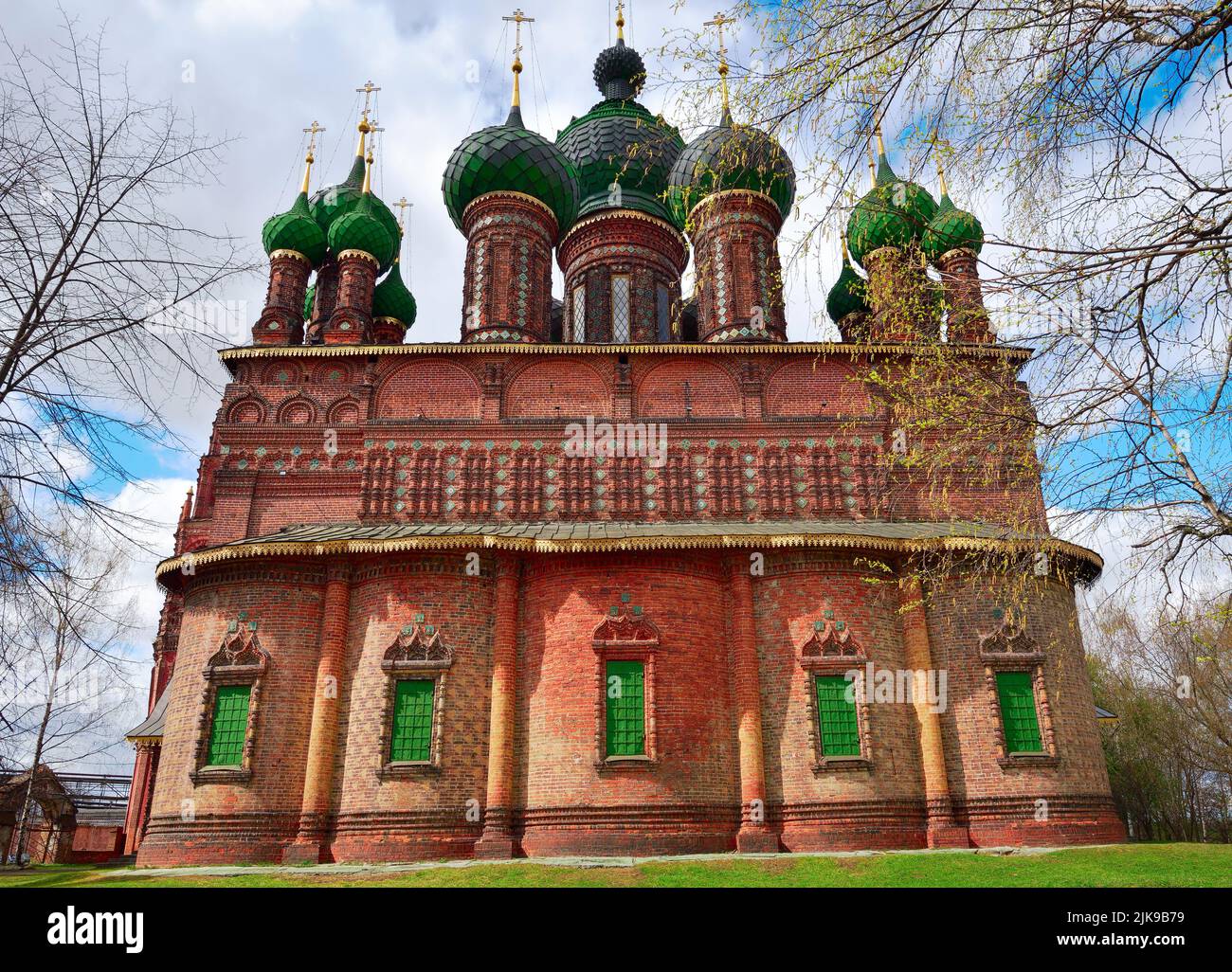 The Church of John the Baptist. Brick facade with colored tiles, a ...