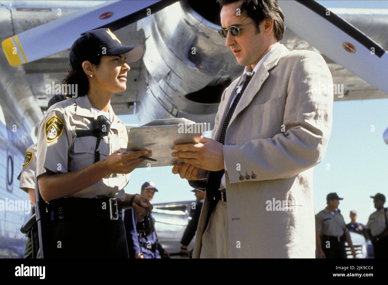 Rachel Ticotin & John Cusack Film: Con Air (USA 1997) Characters: Guard Sally Bishop & U.S ...