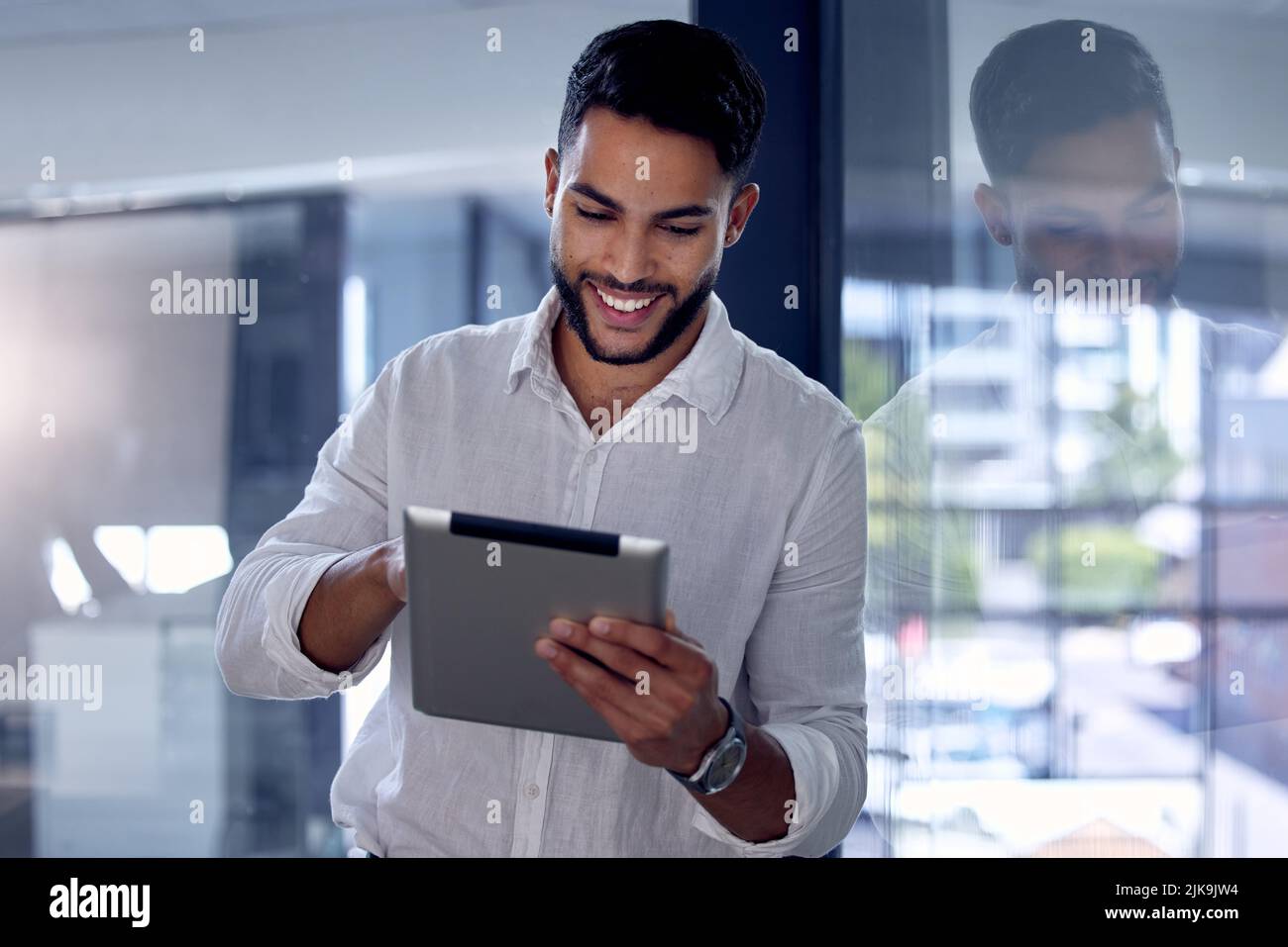 Another day another deal closed. a young businessman using his digital ...