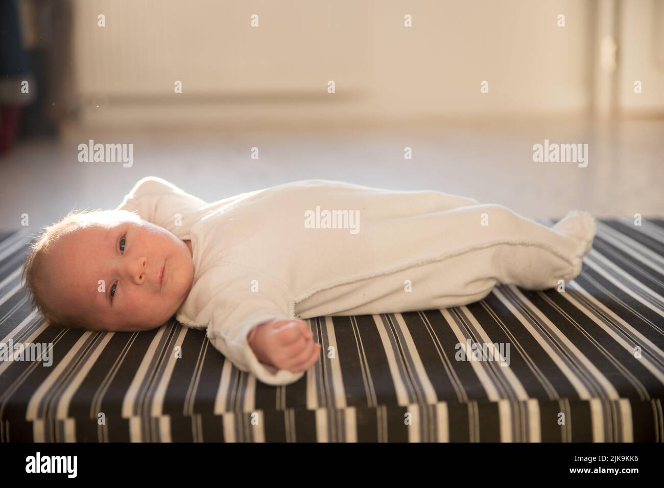 A newborn baby lying on his back Stock Photo - Alamy