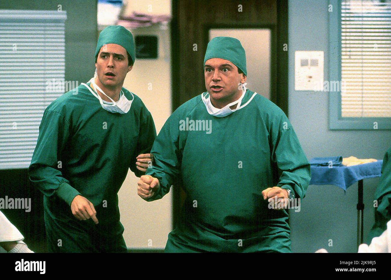 Hugh Grant & Tom Arnold Film: Nine Months (USA 1995) Characters: Samuel ...