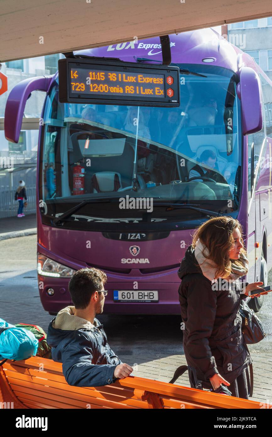 Couple witing for a bus at Bussijaama bus station in Tallinn Estonia ...