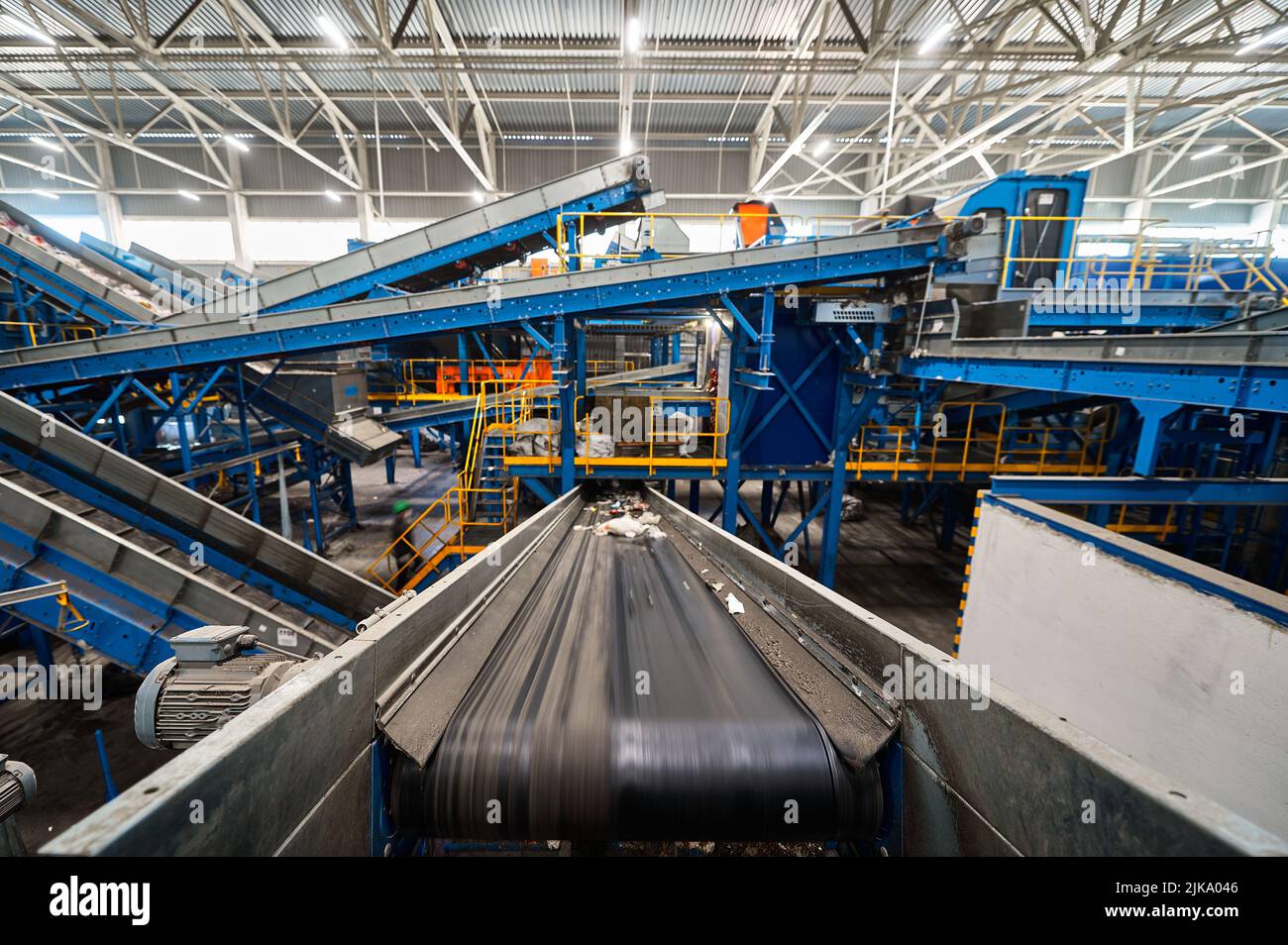 Conveyor carries trash pieces in recycling plant workshop Stock Photo ...