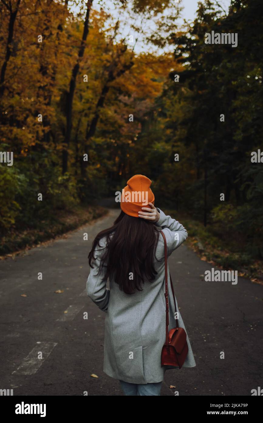 Woman alone walking autumn vertical hi-res stock photography and images ...