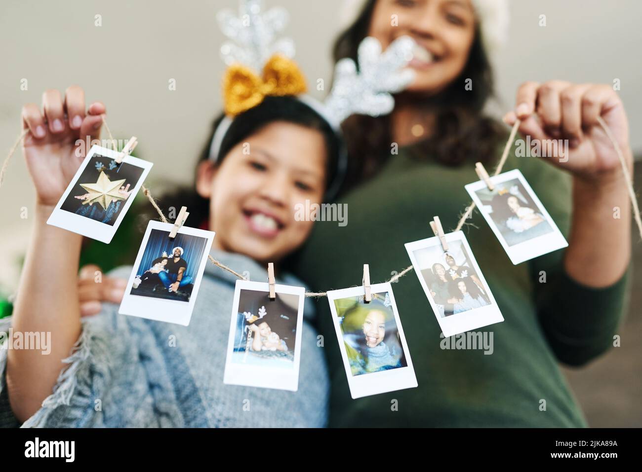 Decorate your home with happy family memories. a happy young mother and ...