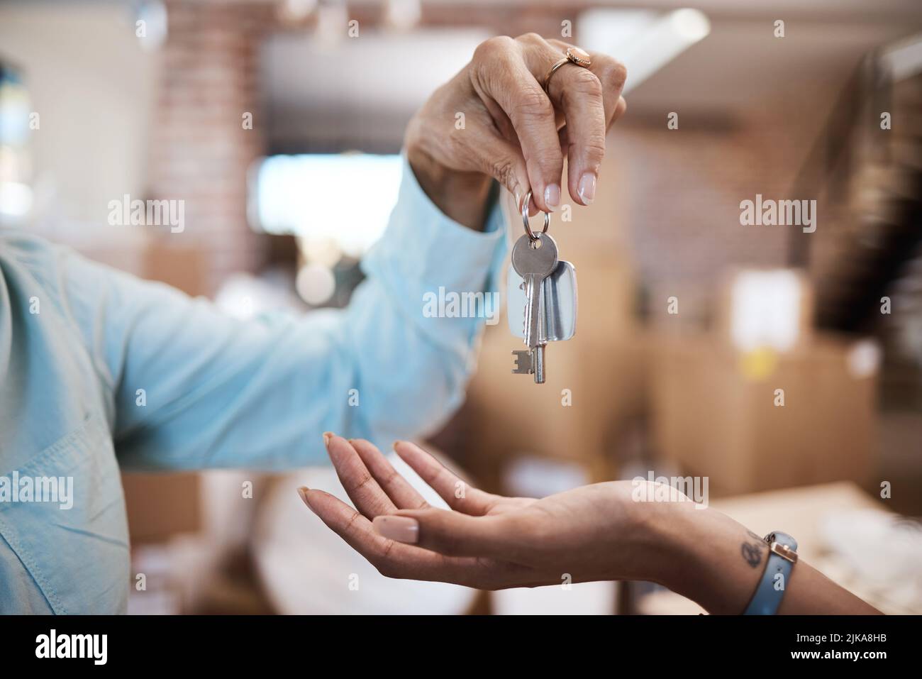 Your new home welcomes you. an unrecognisable handing over the keys to ...