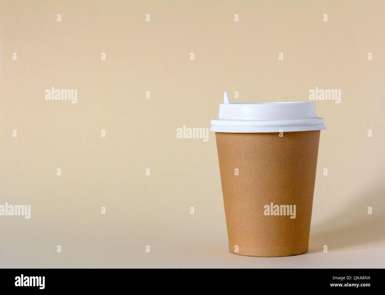 A paper cup for takeaway coffee on a light beige background Stock Photo ...