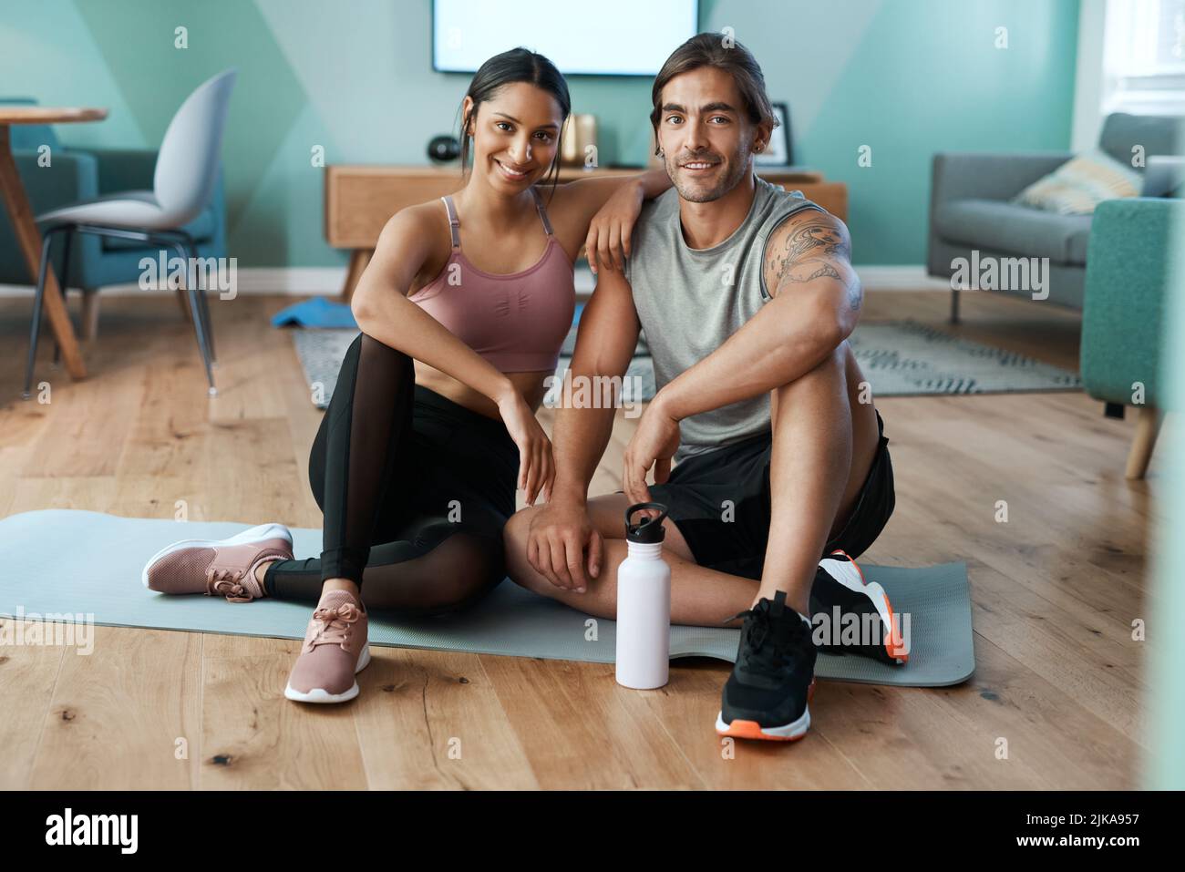 We do all our workouts together. Full length portrait of an athletic ...