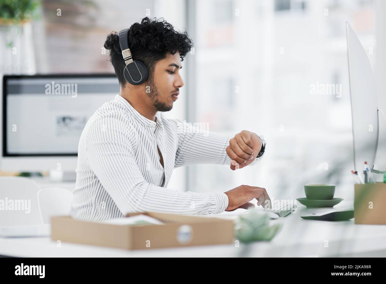 Time management will help you achieve your goals. a young businessman ...