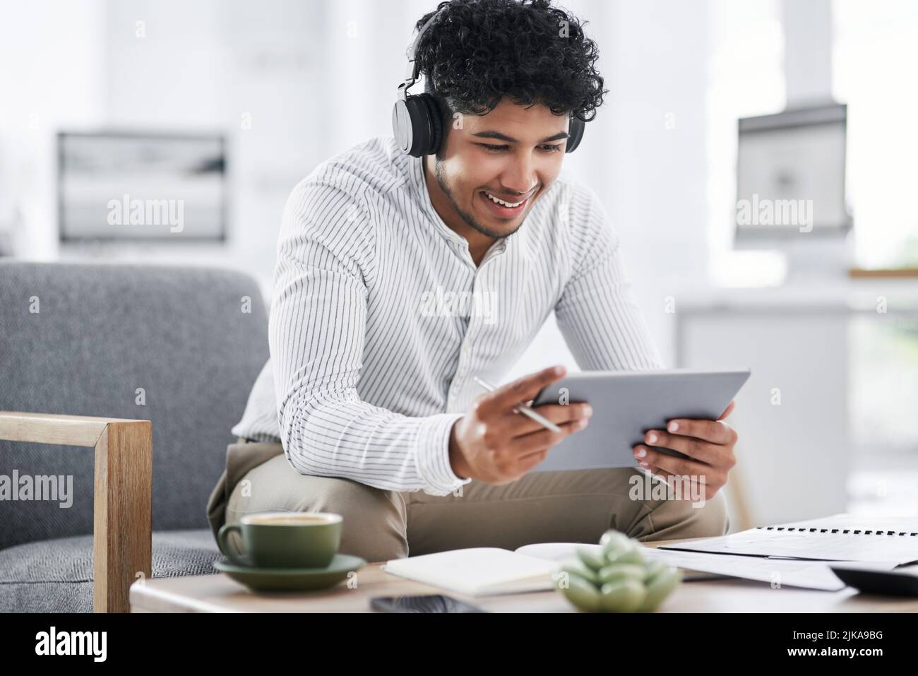 Its his business gadget of choice. a young businessman wearing ...