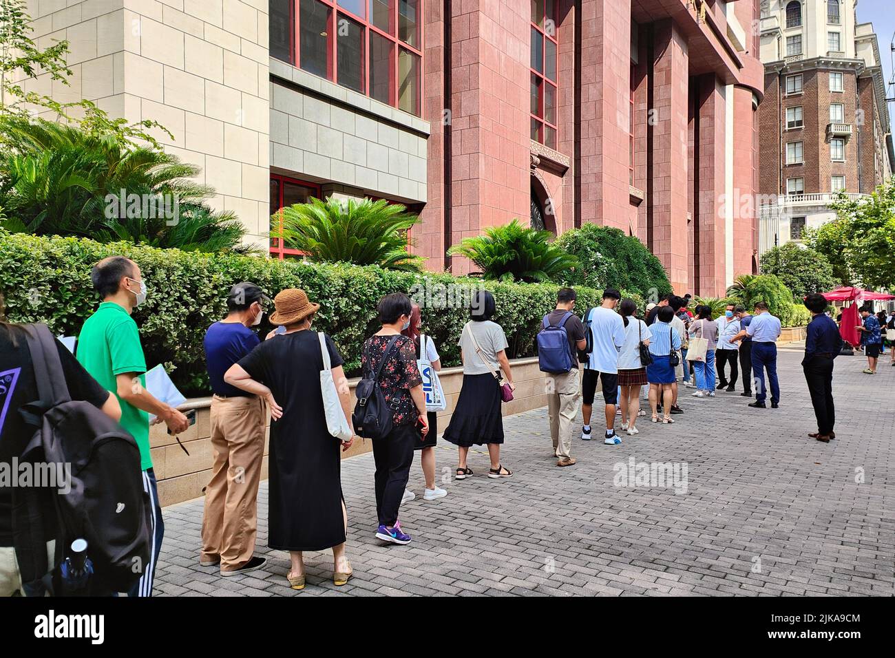SHANGHAI, CHINA - AUGUST 1, 2022 - A long queue forms in front of a ...