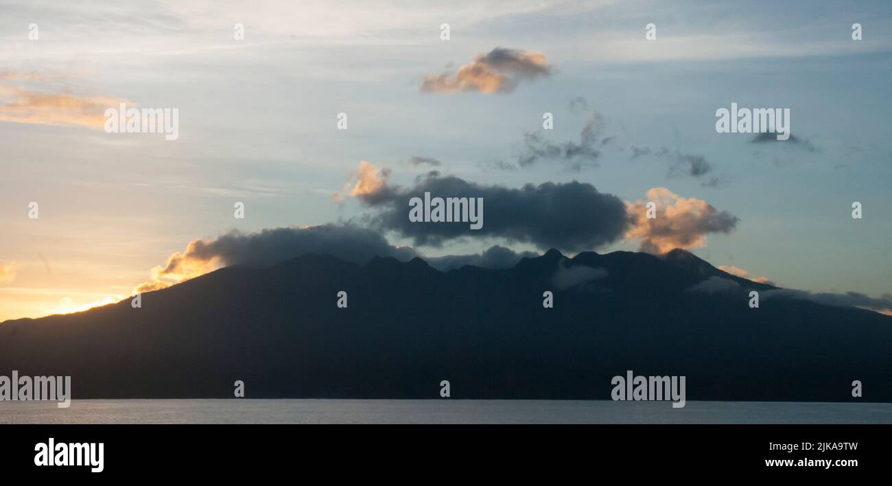 1800-metre volcanic cone of Kolombangara Island at dawn, Solomon ...