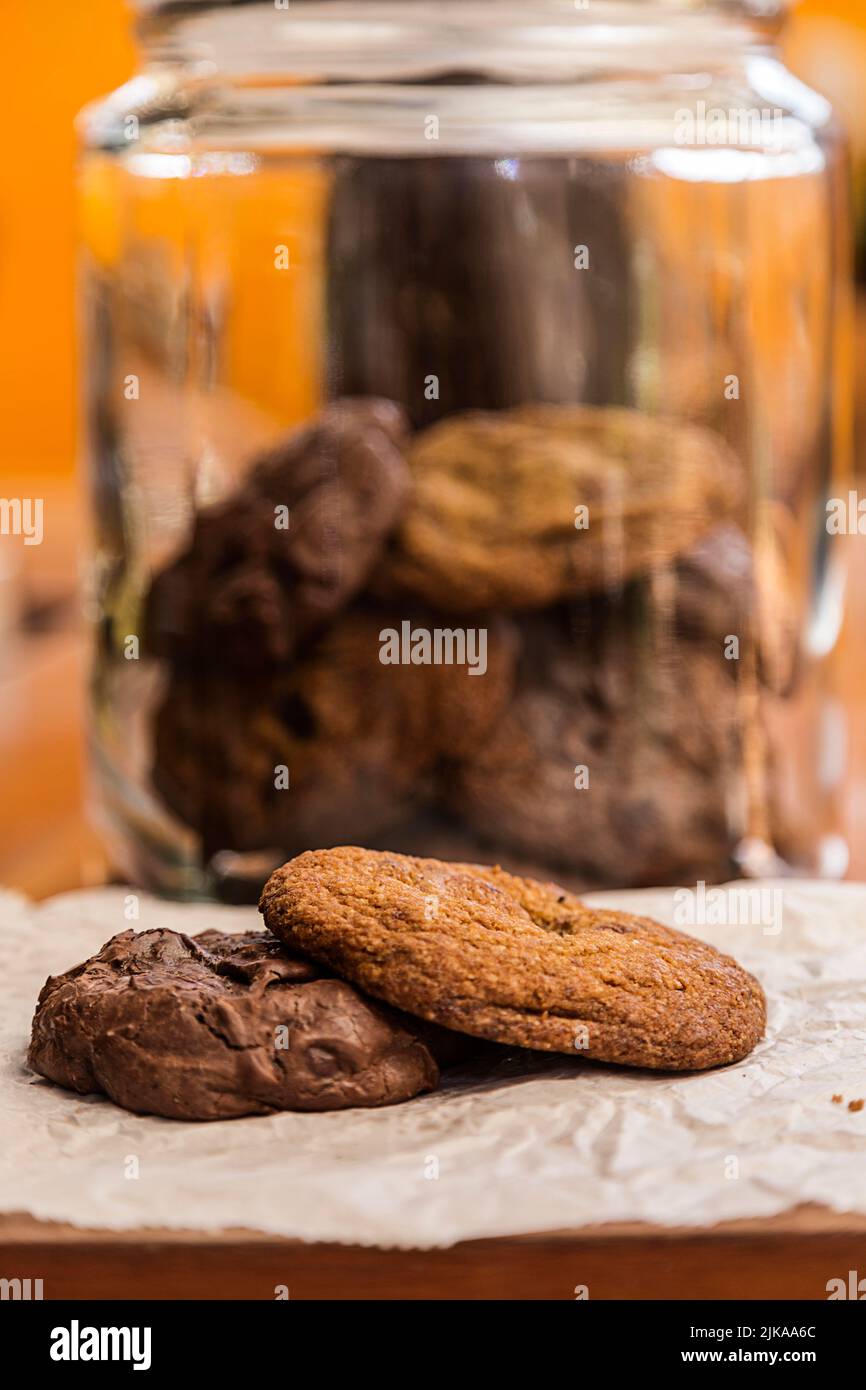 Delicious chocolate and honey cookies and a jar full of cookies in a ...