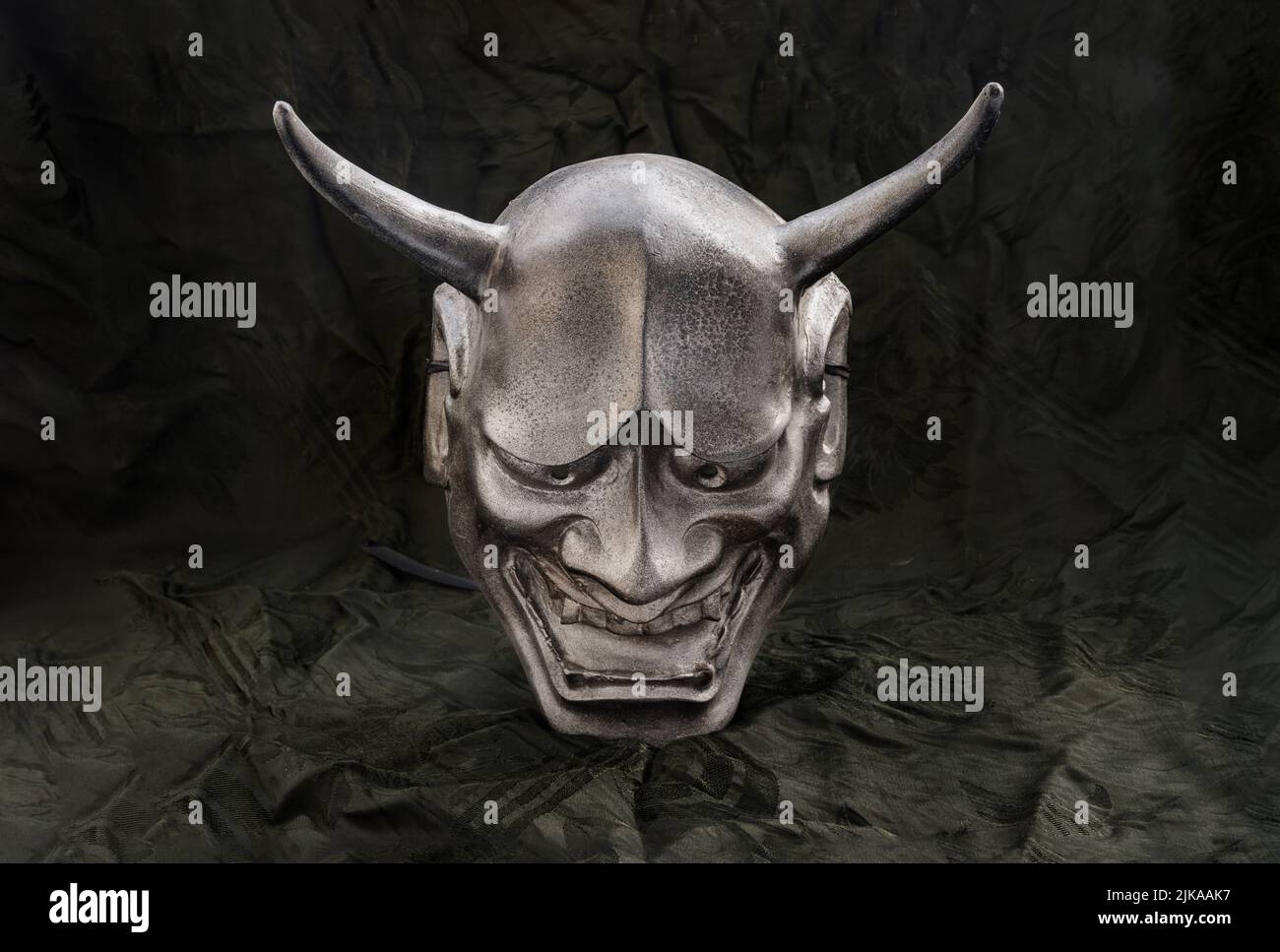 Traditional japanese mask of a demon on dark background. The mask ...