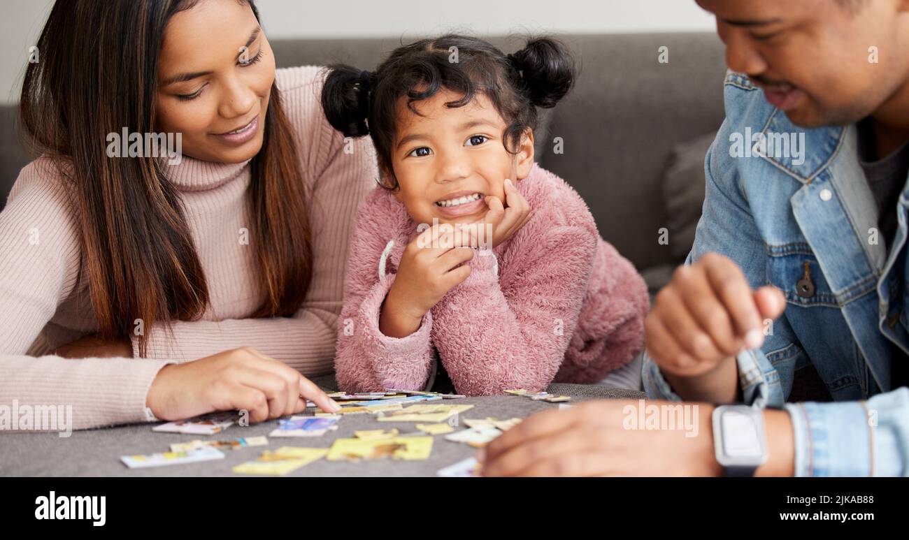We love spending time with our daughter. young parents helping their ...