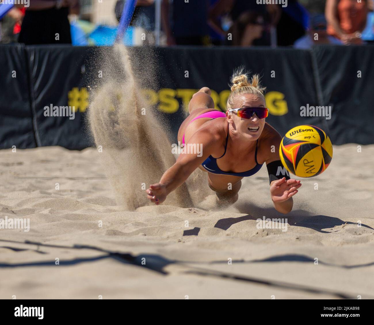 Sara Hughes (USA) digs the ball during second round action at the AVP ...