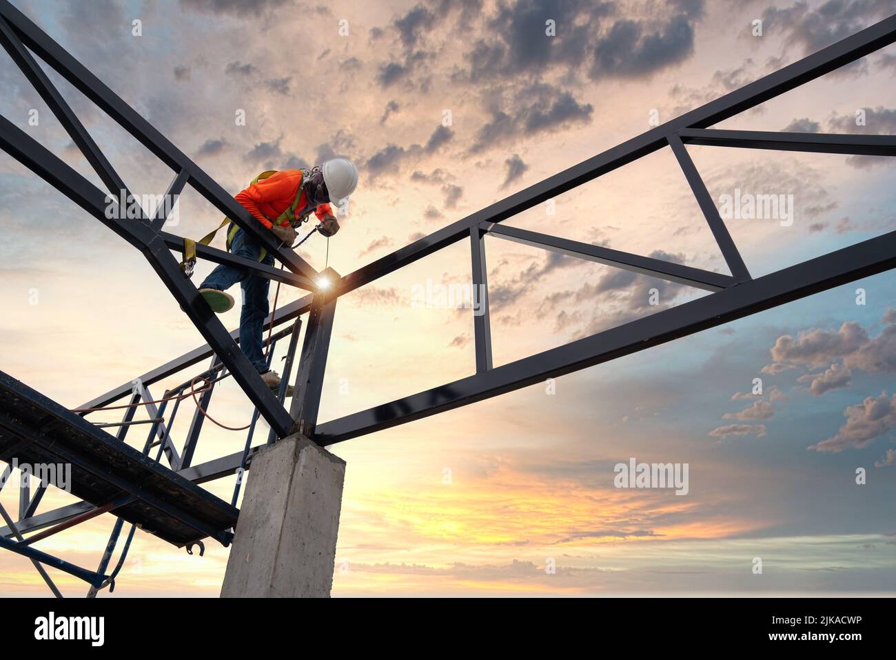 Steel roof truss welders with safety devices to prevent falls from a ...