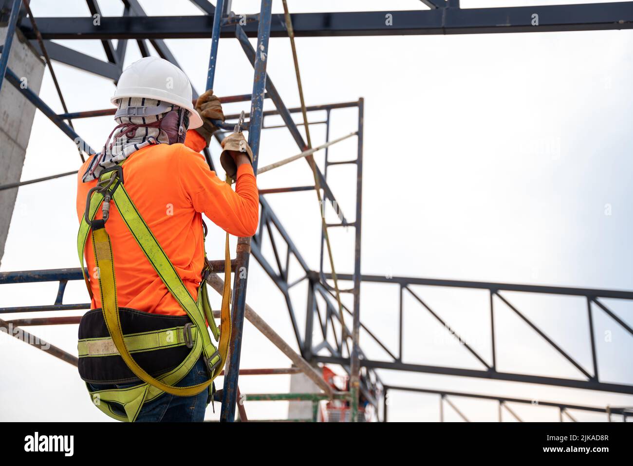 Workers are working on steel roof trusses with Fall arrestor device for ...