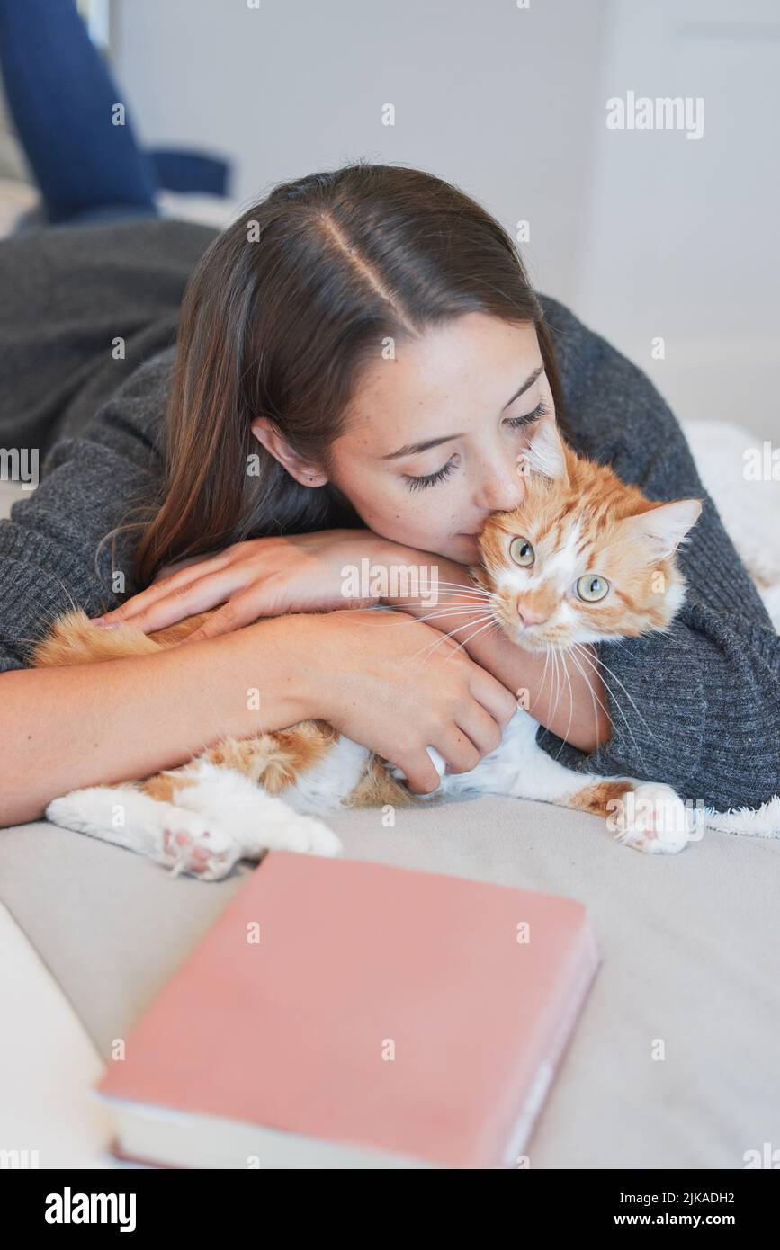 Cats are my favourite people. a young woman bonding with her cat at ...