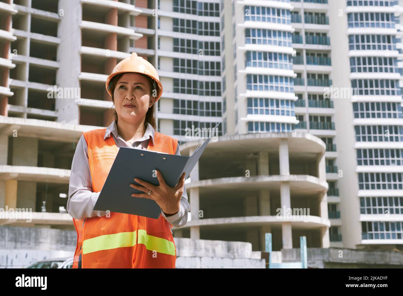 Portrait of professional Vietnamese engineer at the construction site ...