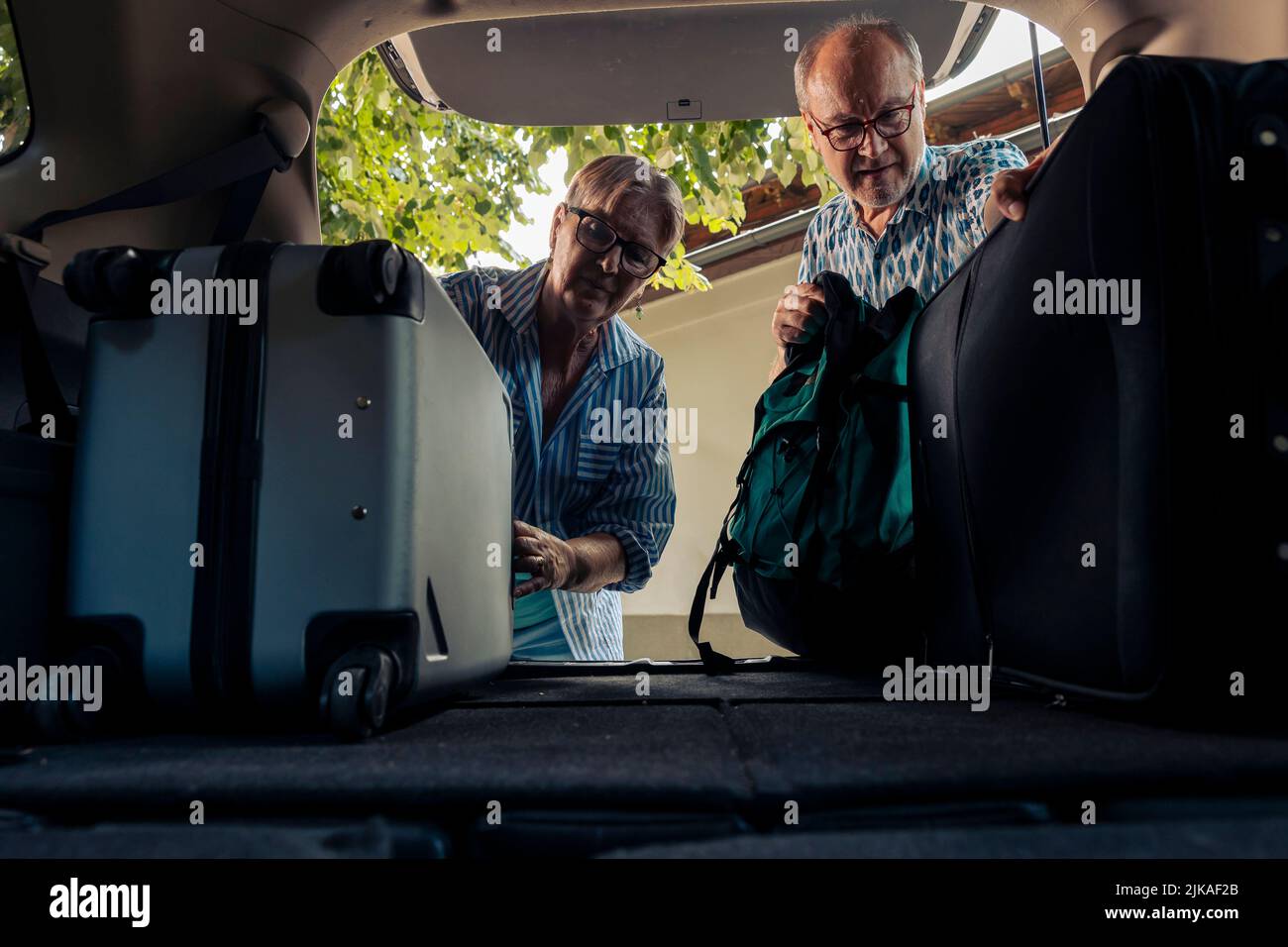 Elderly loading car trunk hi-res stock photography and images - Alamy