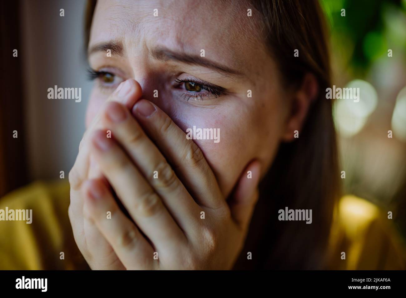 Woman suffering from depression and crying at home Stock Photo - Alamy
