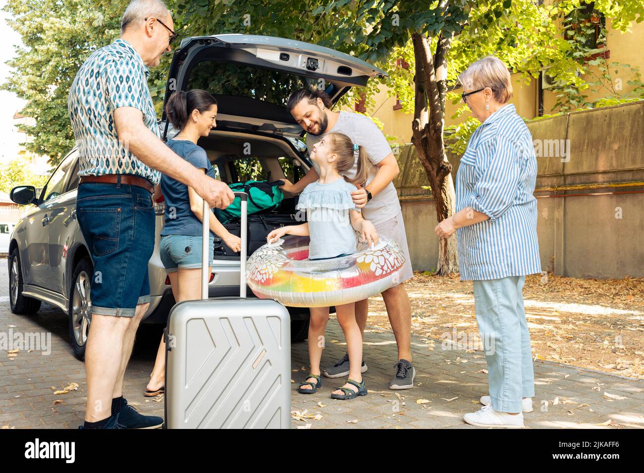 Happy family travelling at seaside with car, leaving on vacation trip ...