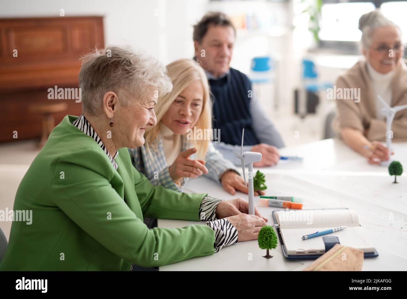 Group of senior students discussing about altenrative energy in ...