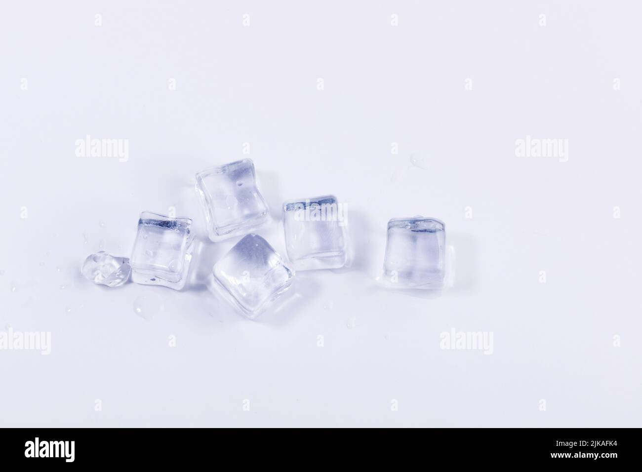 creative summer photo of ice, white background Stock Photo - Alamy
