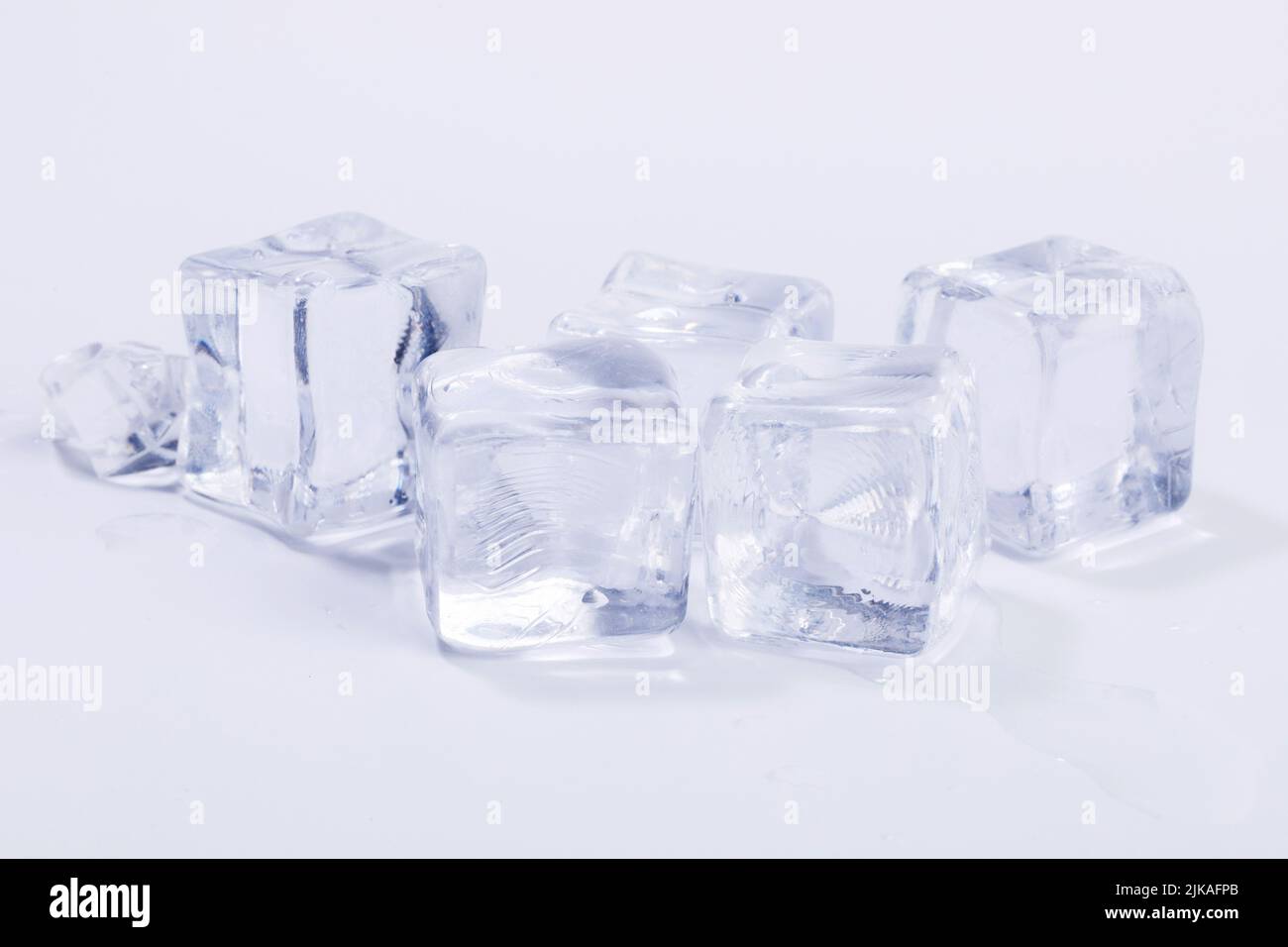 creative summer photo of ice, white background Stock Photo - Alamy
