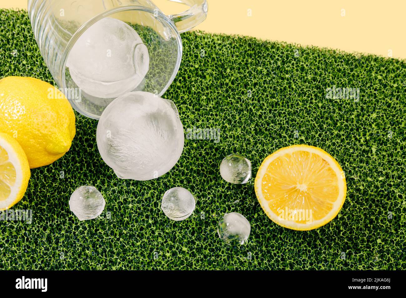creative summer photo of ice and lemon, yellow background Stock Photo ...