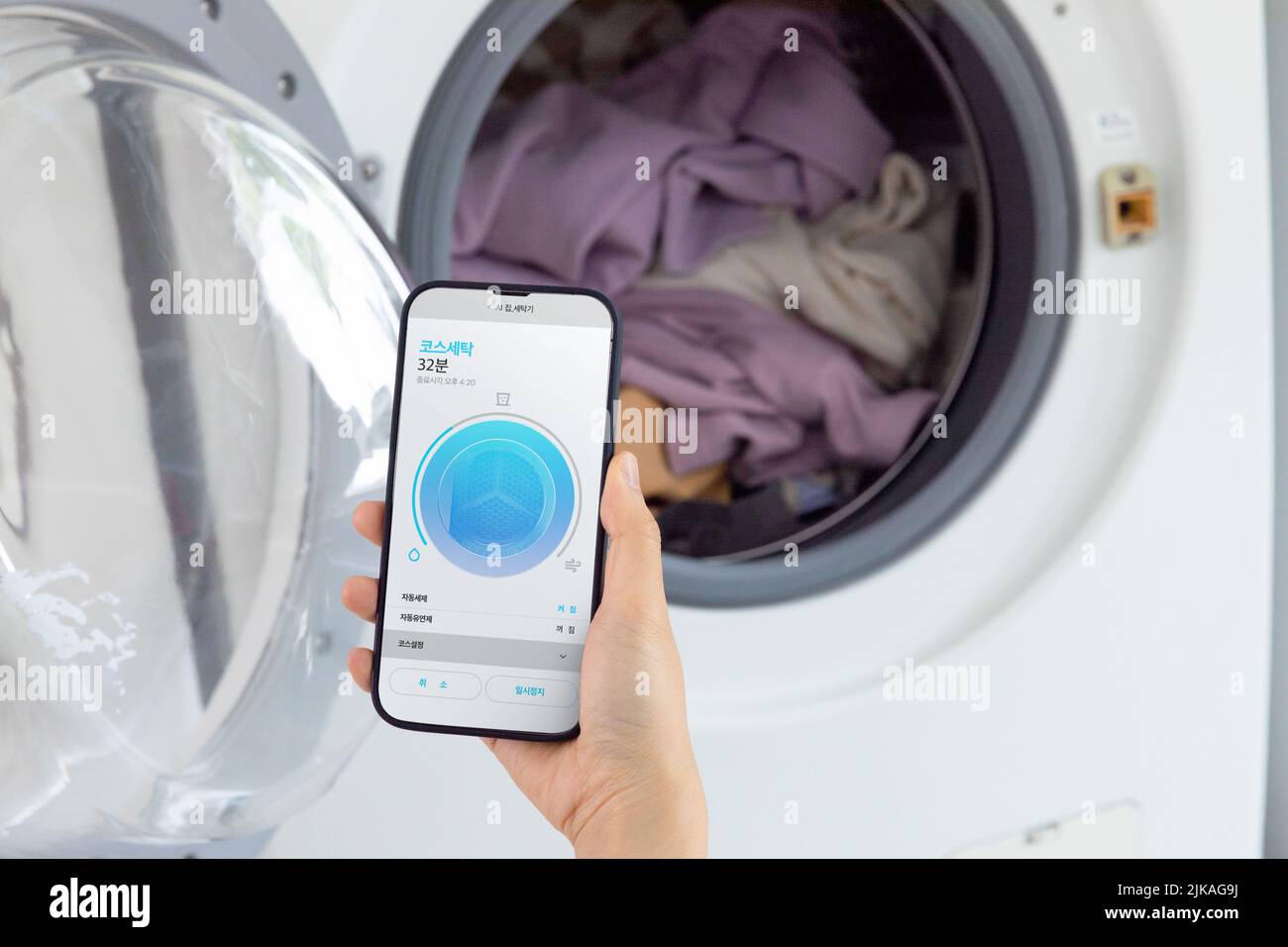 aesthetic laundry concept Connecting washing machine app with mobile ...